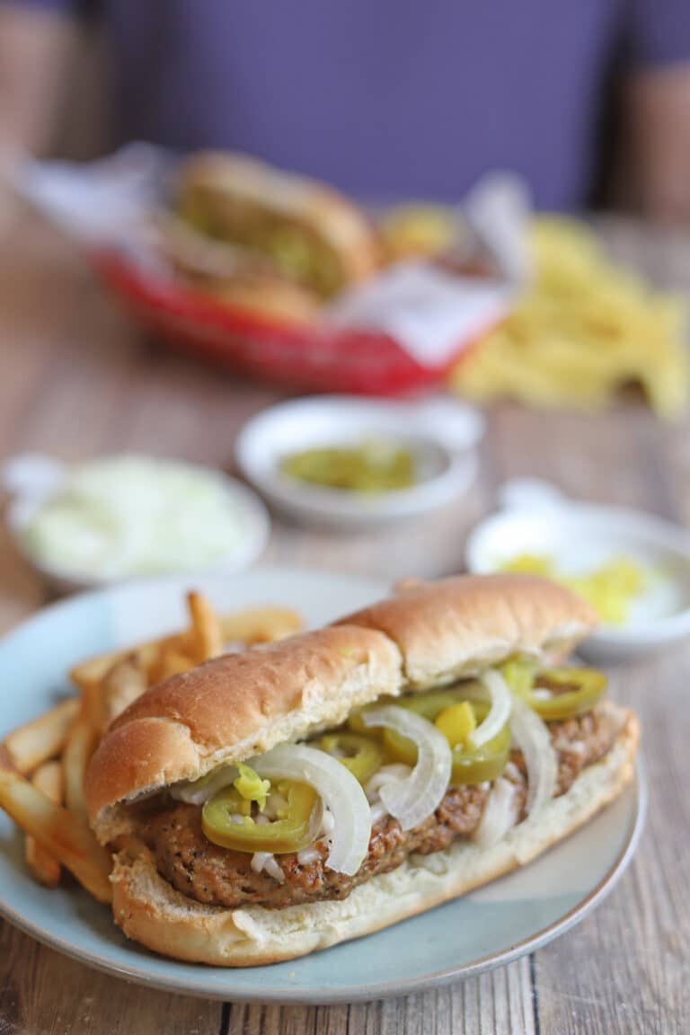 Spicy vegan hot sausage sandwich with cheese and pickled jalapeños ...