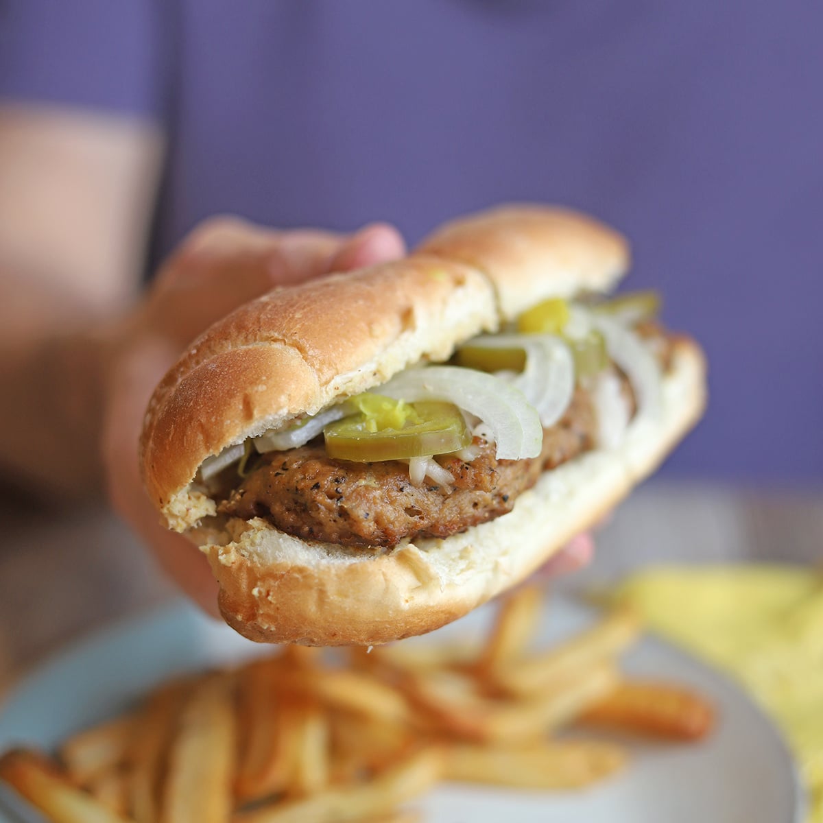 Spicy vegan hot sausage sandwich with cheese and pickled jalapeños ...